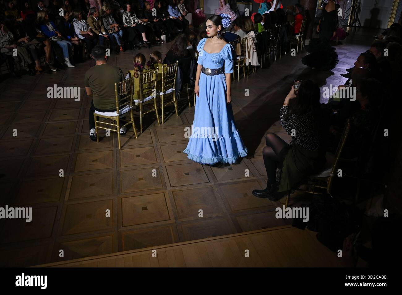 A model walks in a Angela Isa design at the International Flamenco ...