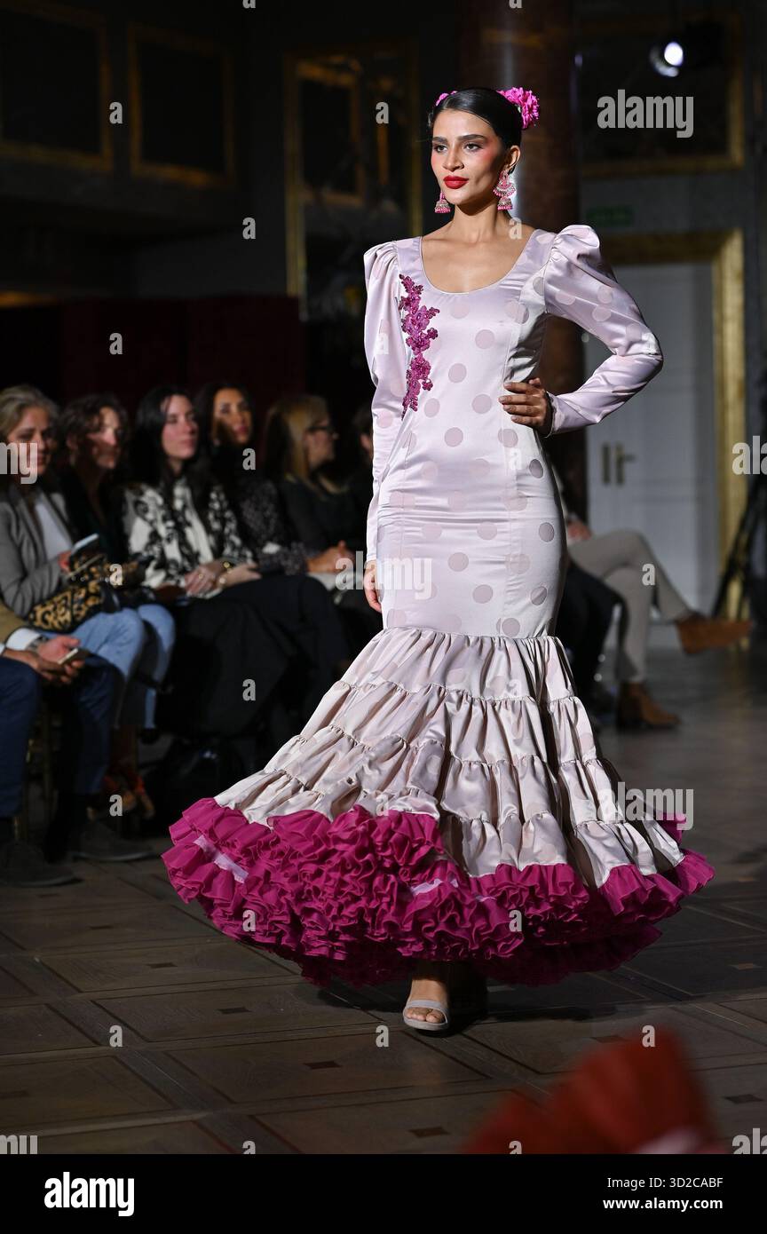 A model walks in a Angela Isa design at the International Flamenco ...