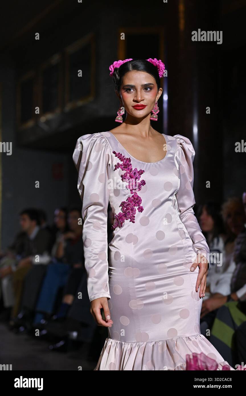 A model walks in a Angela Isa design at the International Flamenco ...