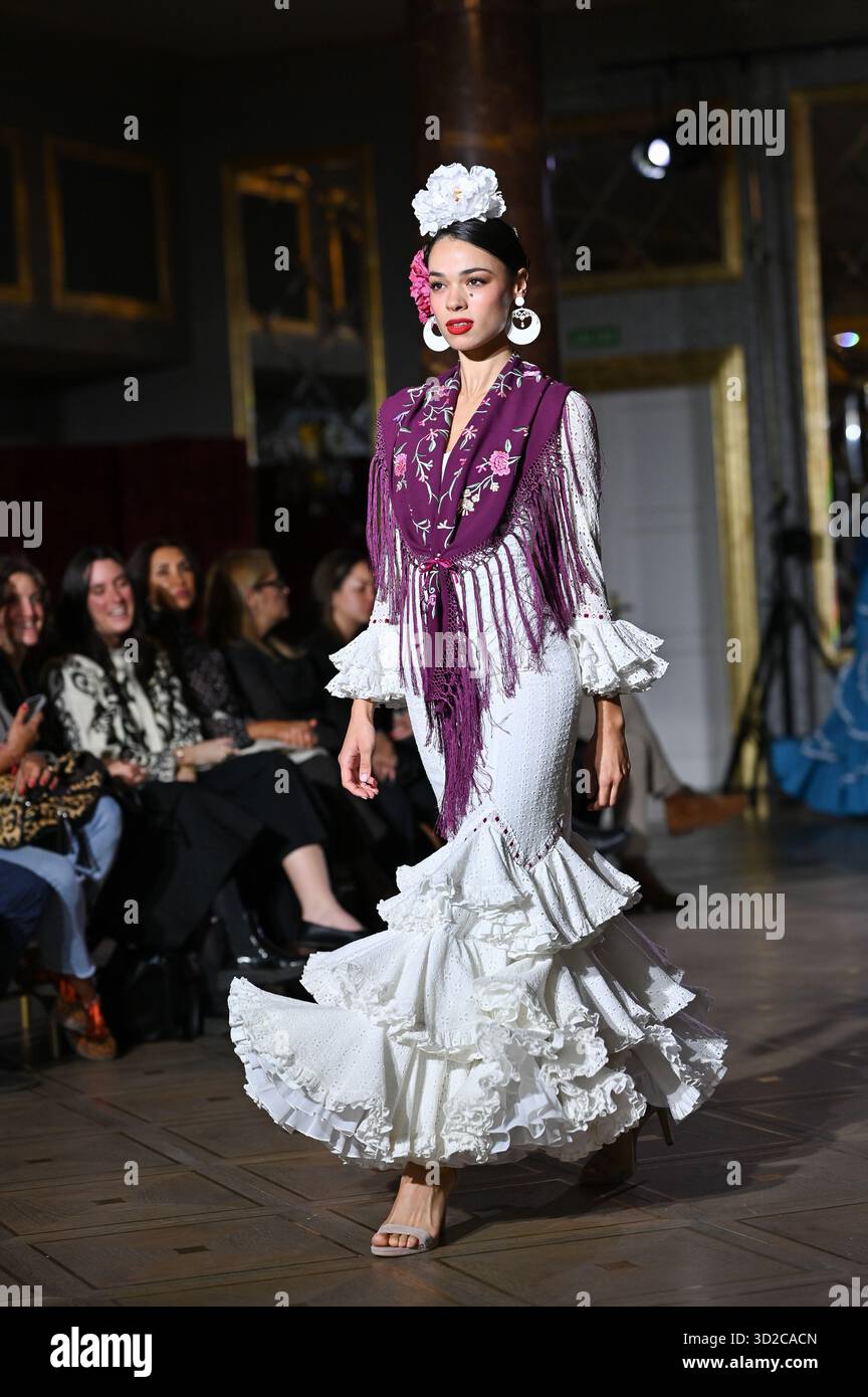 A model walks in a Angela Isa design at the International Flamenco ...