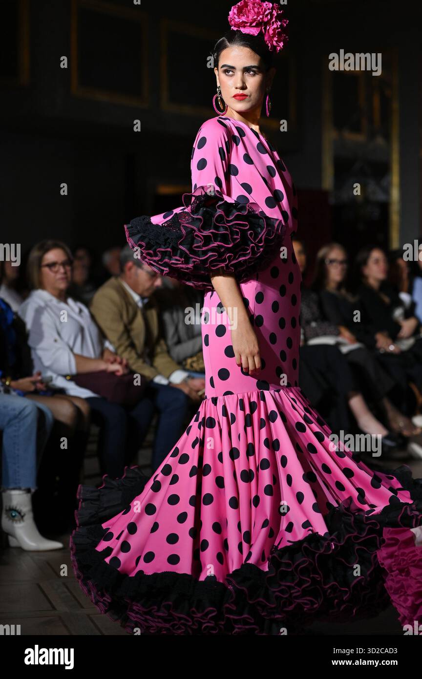 A model walks in a Angela Isa design at the International Flamenco ...