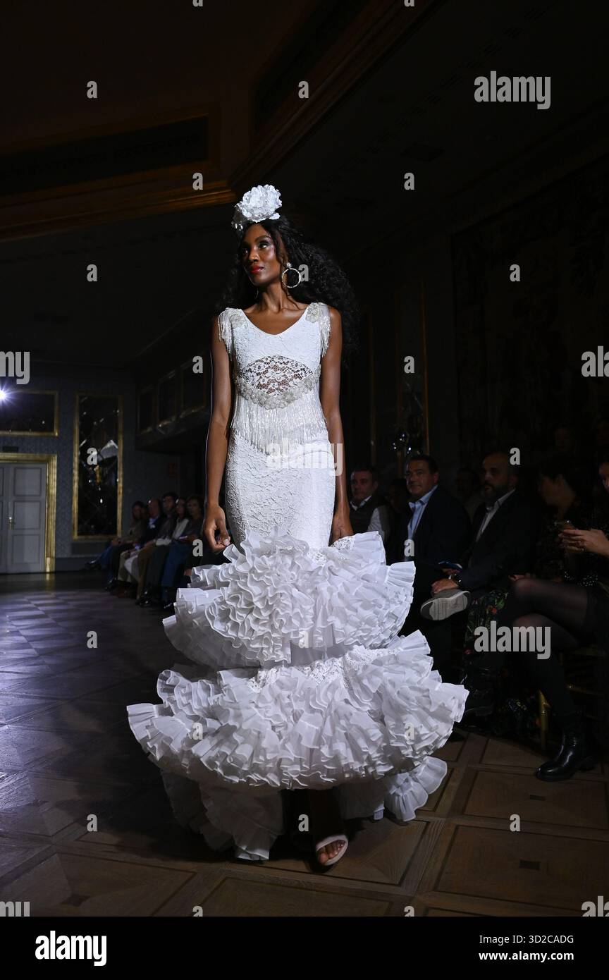 A model walks in a Angela Isa design at the International Flamenco ...