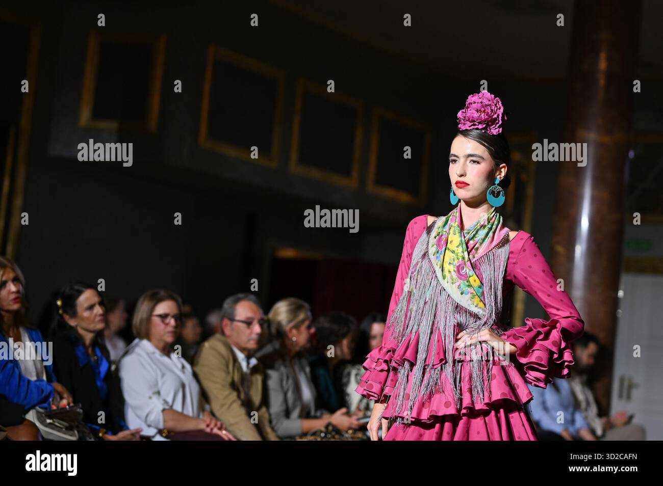 A model walks in a Angela Isa design at the International Flamenco ...