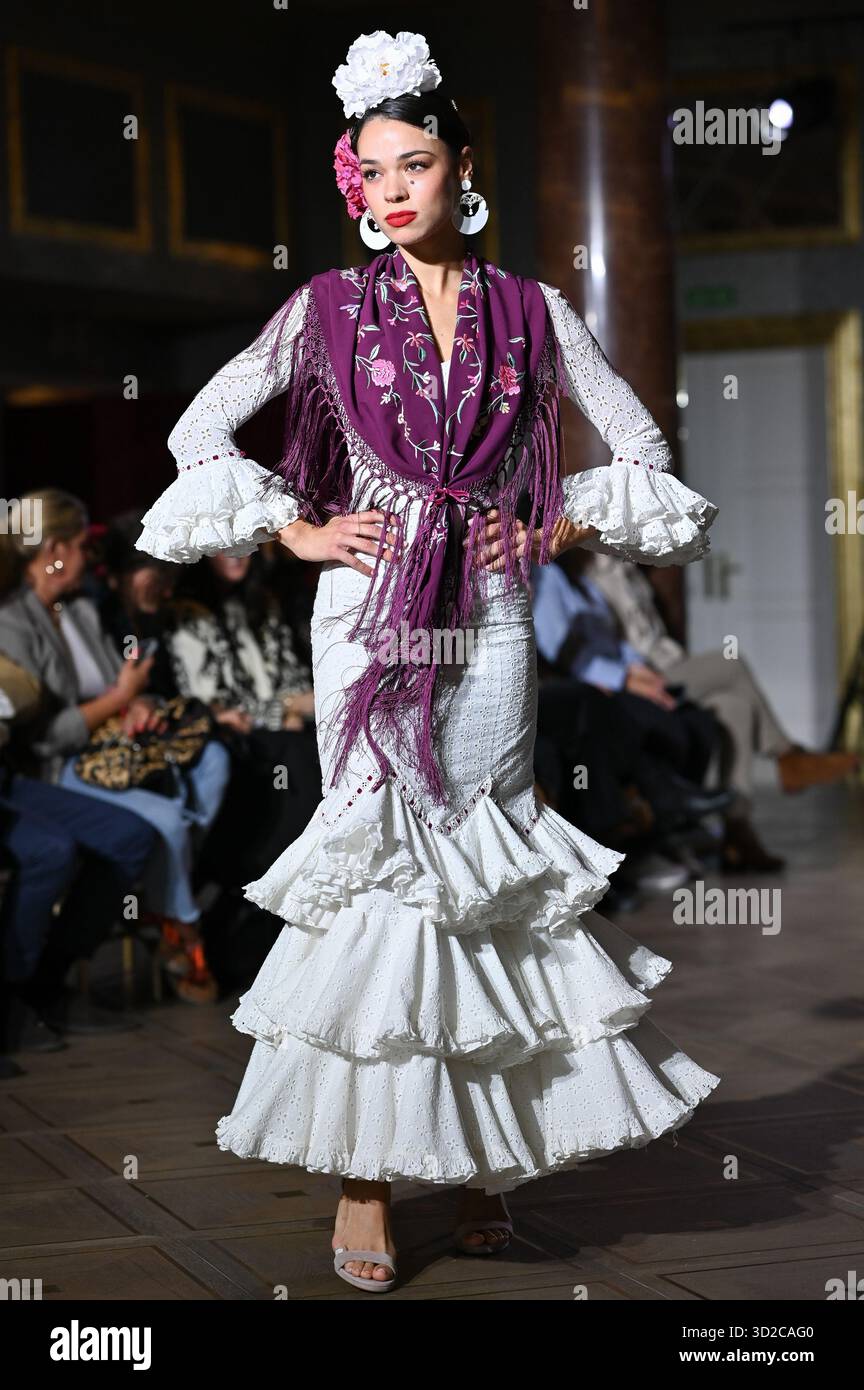 A model walks in a Angela Isa design at the International Flamenco ...