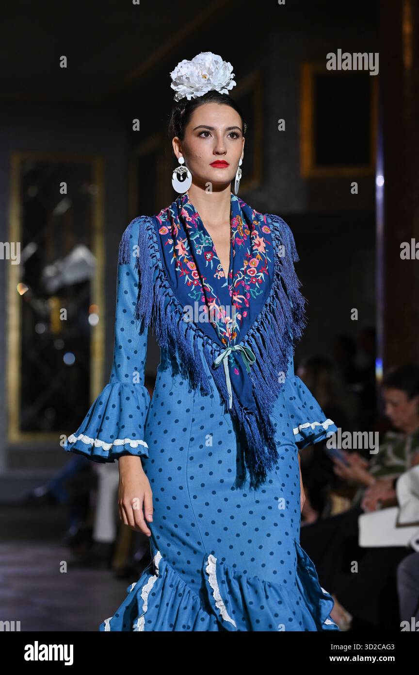 A model walks in a Angela Isa design at the International Flamenco ...