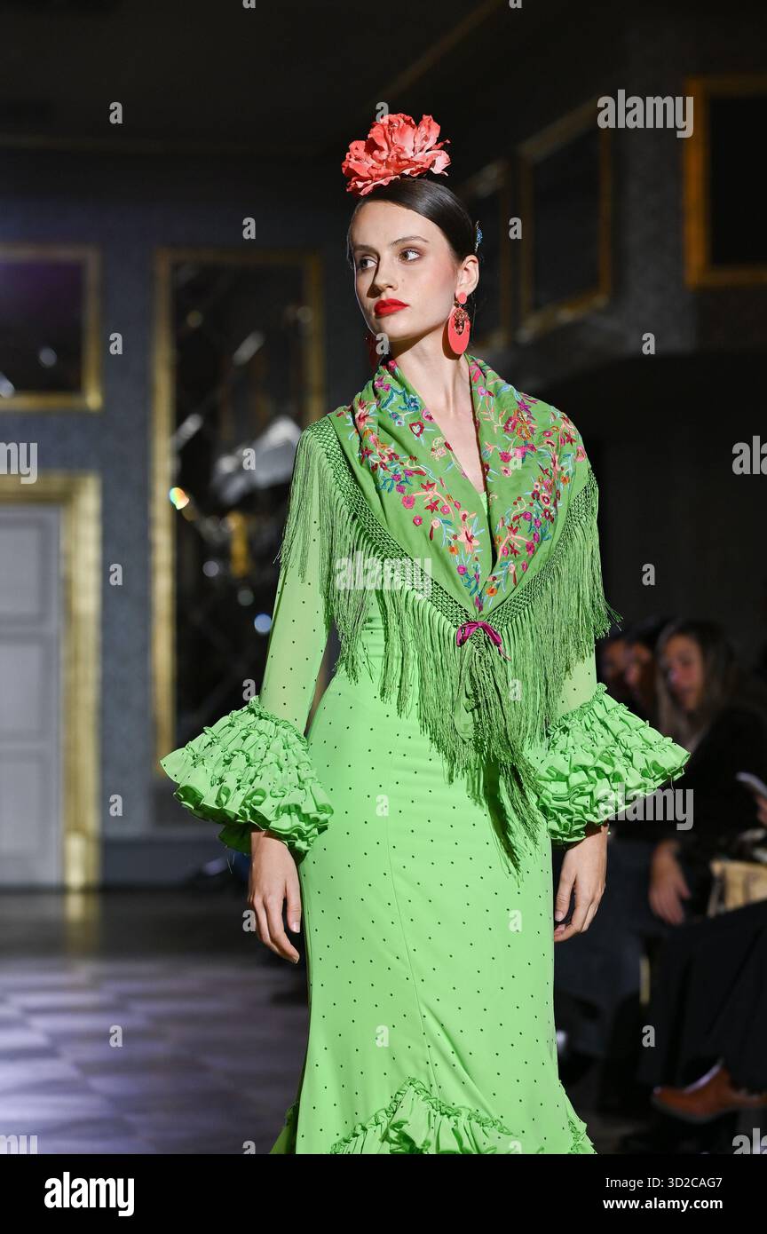 A model walks in a Angela Isa design at the International Flamenco ...