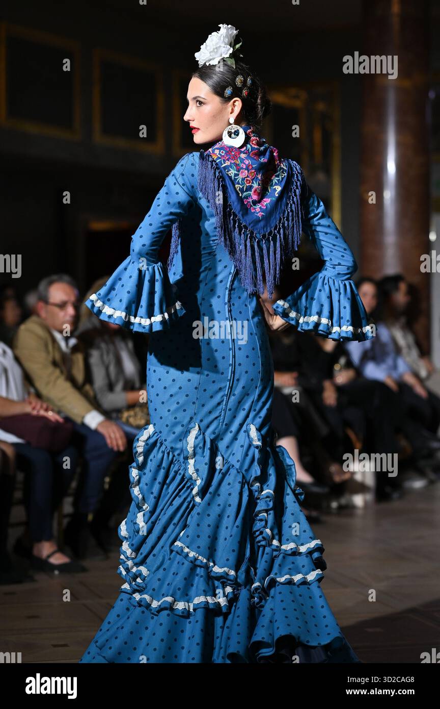 A model walks in a Angela Isa design at the International Flamenco ...