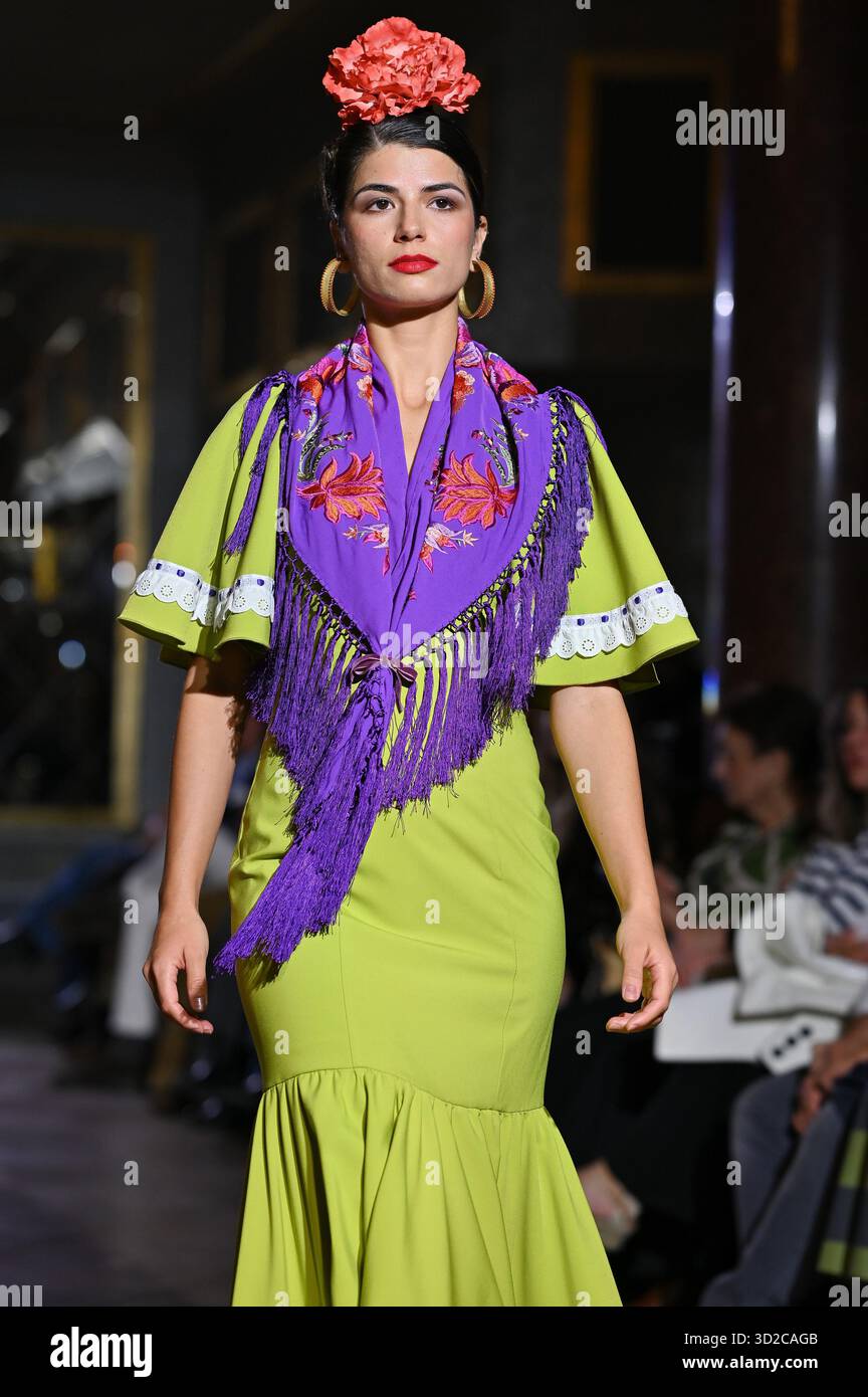 A model walks in a Angela Isa design at the International Flamenco ...