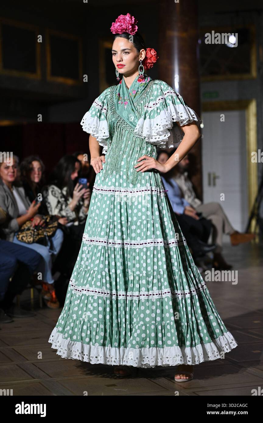 A model walks in a Angela Isa design at the International Flamenco ...