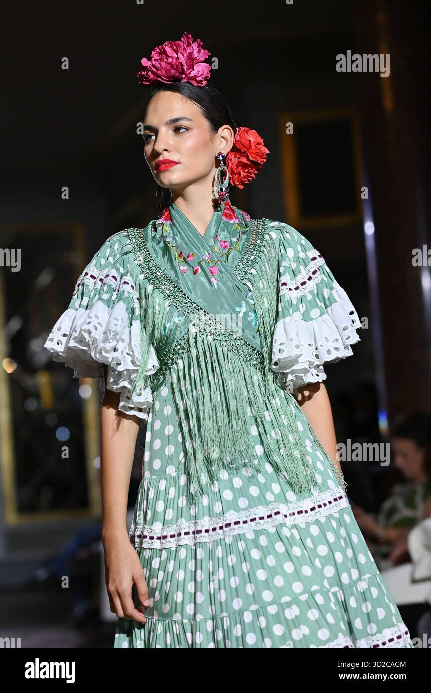 A model walks in a Angela Isa design at the International Flamenco ...