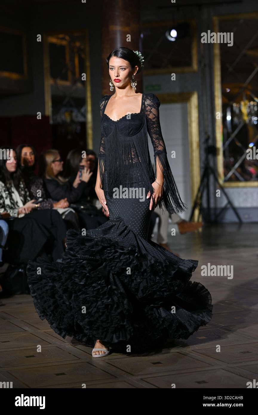 A model walks in a Angela Isa design at the International Flamenco ...