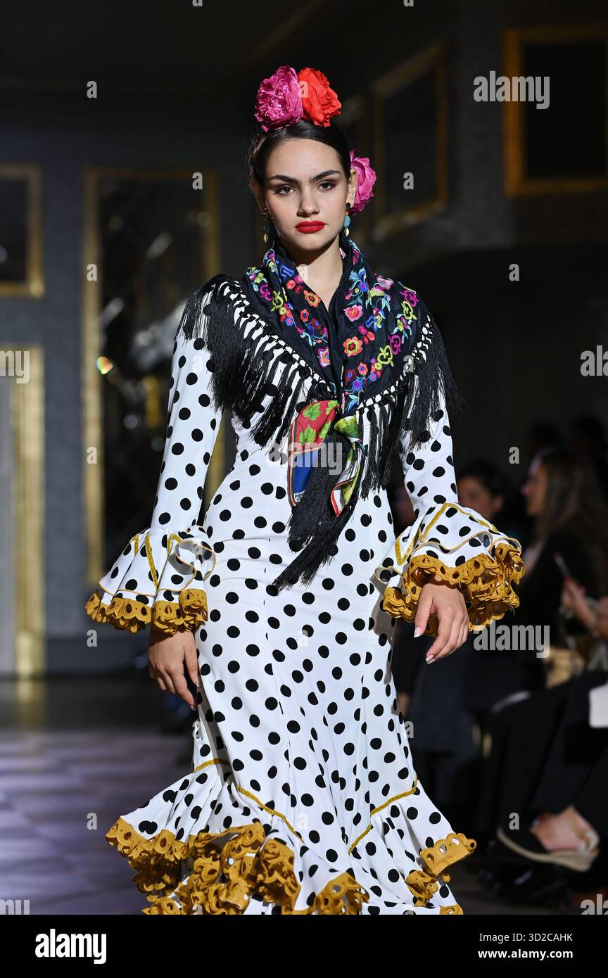 A model walks in a Angela Isa design at the International Flamenco ...