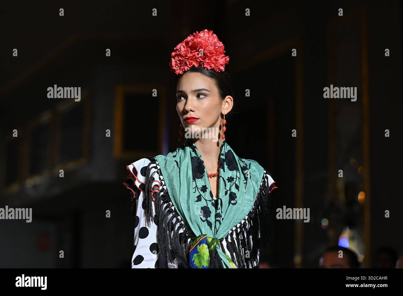 A model walks in a Angela Isa design at the International Flamenco ...