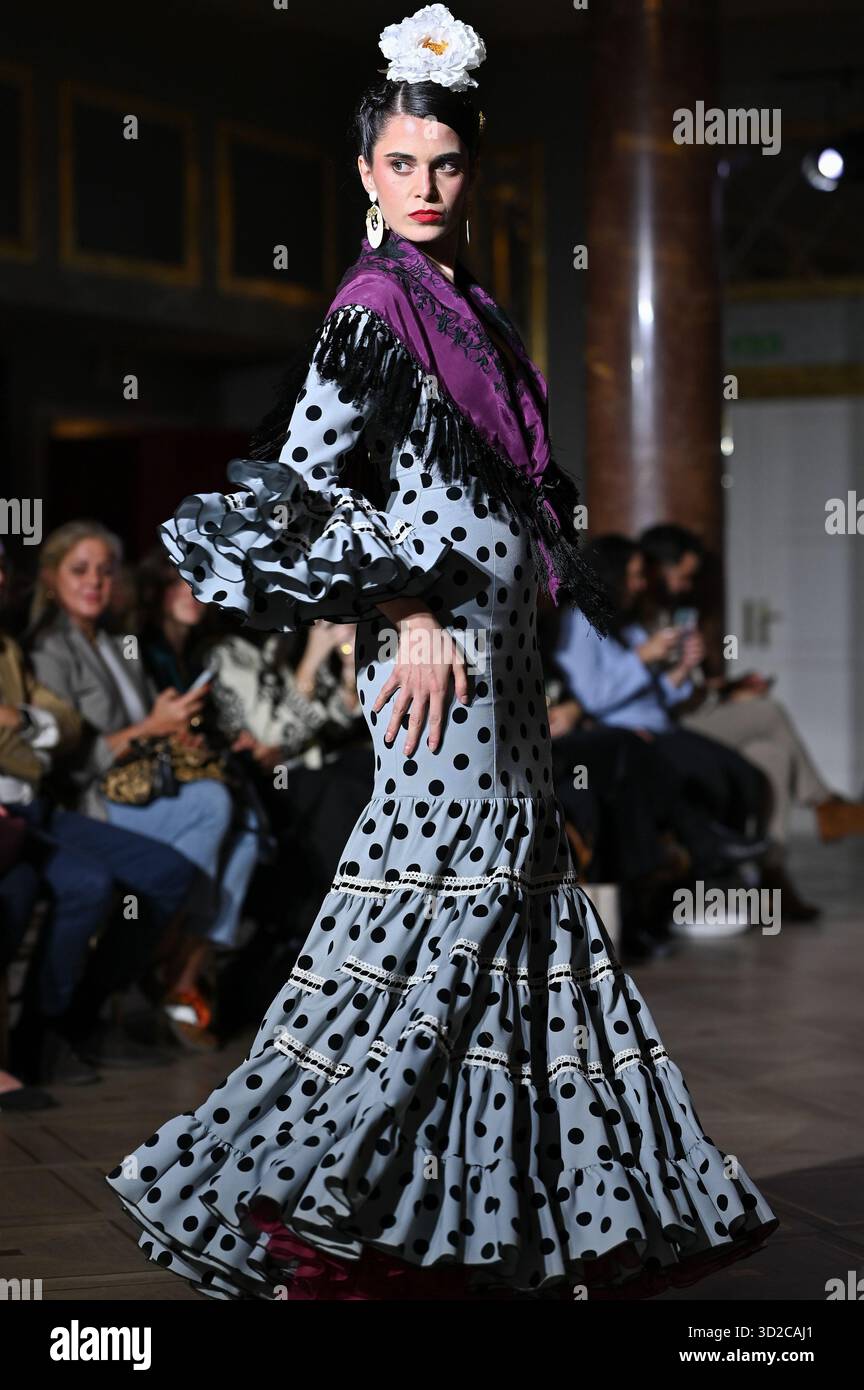 A model walks in a Angela Isa design at the International Flamenco ...
