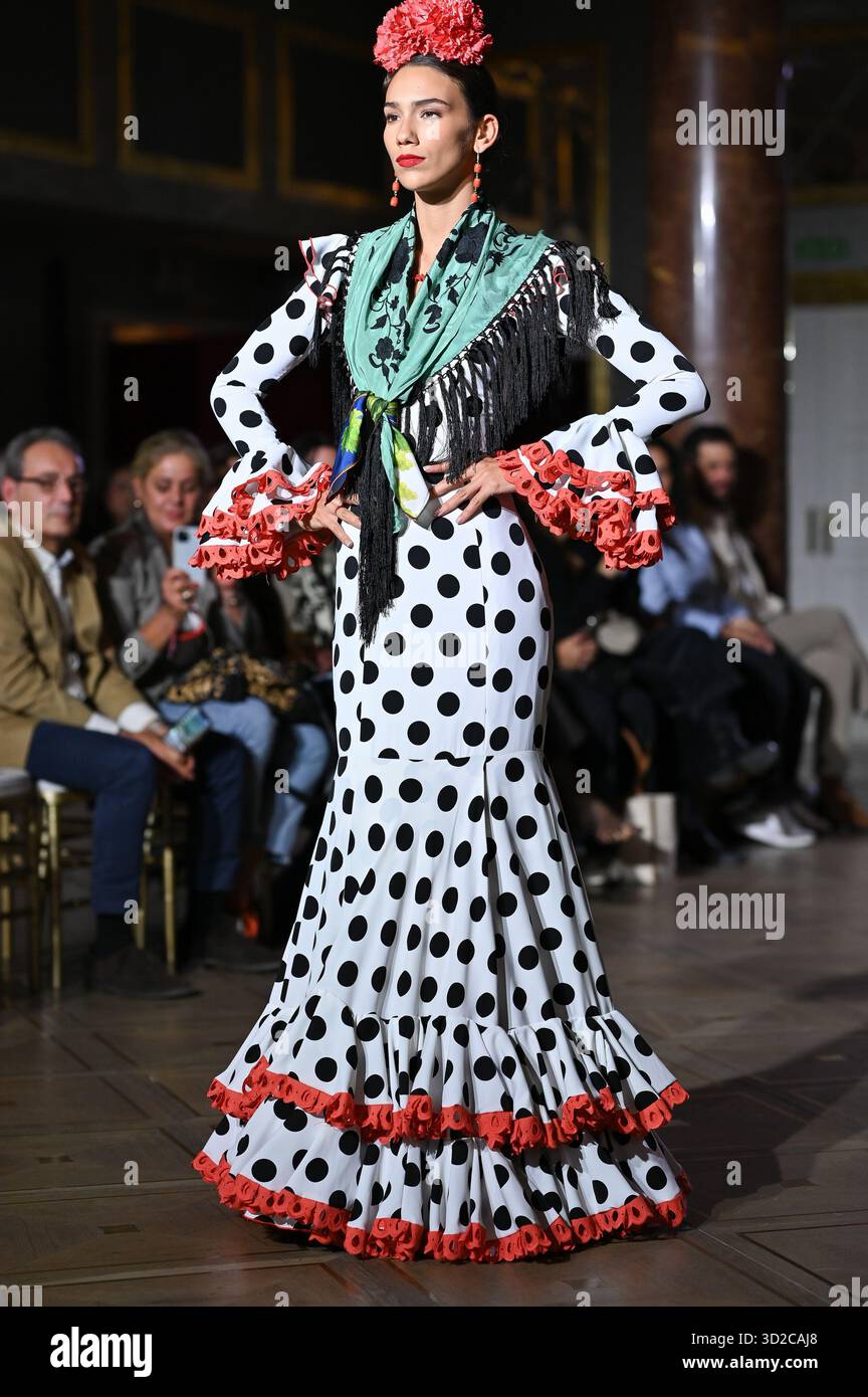A model walks in a Angela Isa design at the International Flamenco ...