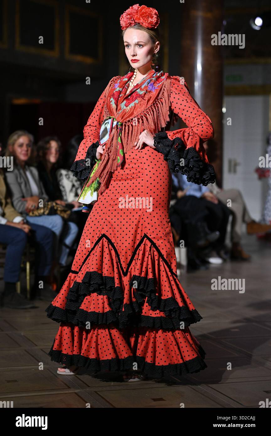 A model walks in a Angela Isa design at the International Flamenco ...