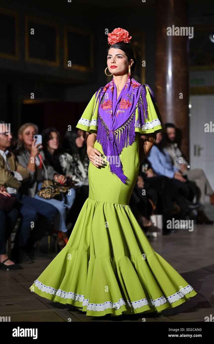 A model walks in a Angela Isa design at the International Flamenco ...