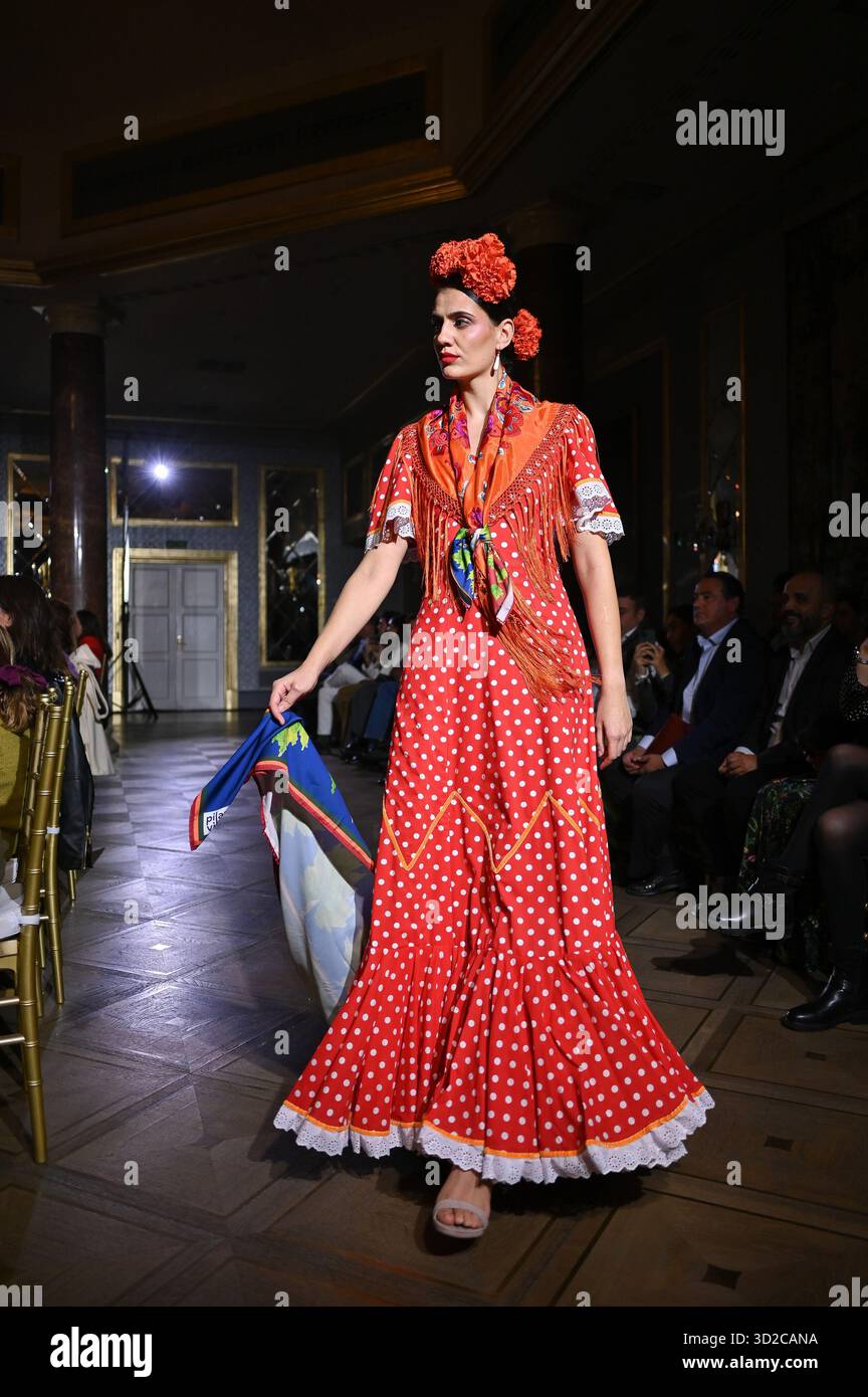 A model walks in a Angela Isa design at the International Flamenco ...