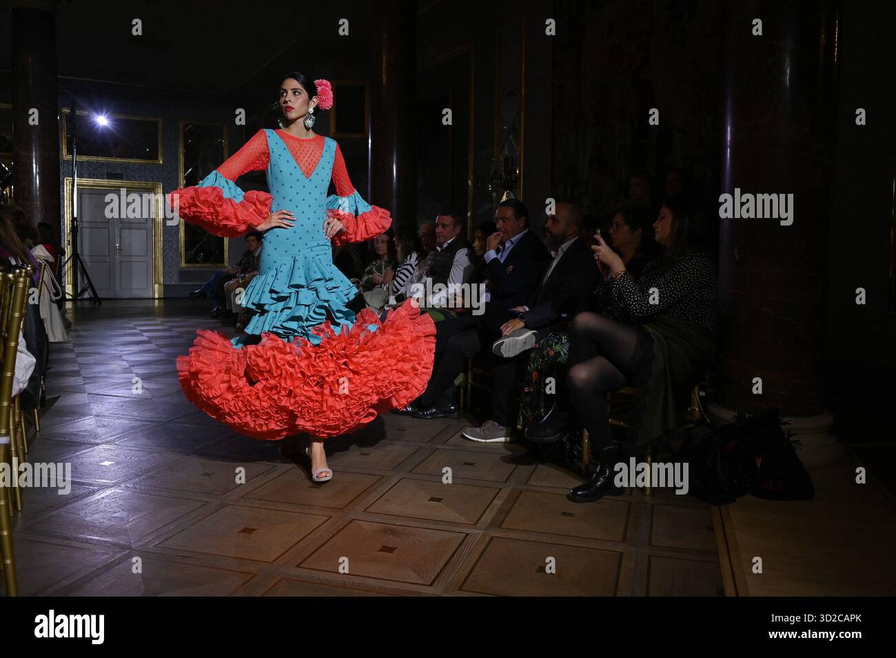 A model walks in a Angela Isa design at the International Flamenco ...