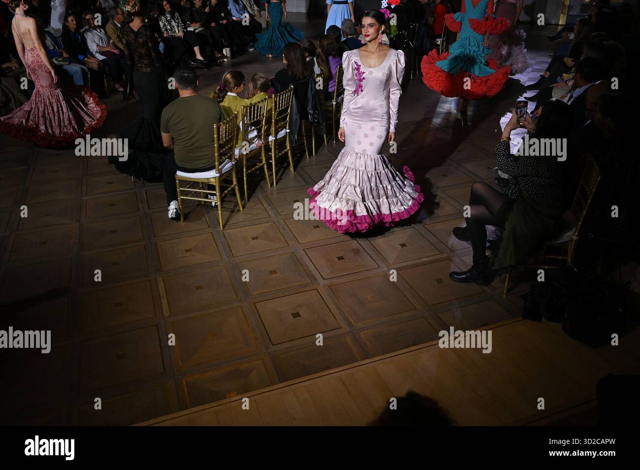A model walks in a Angela Isa design at the International Flamenco ...