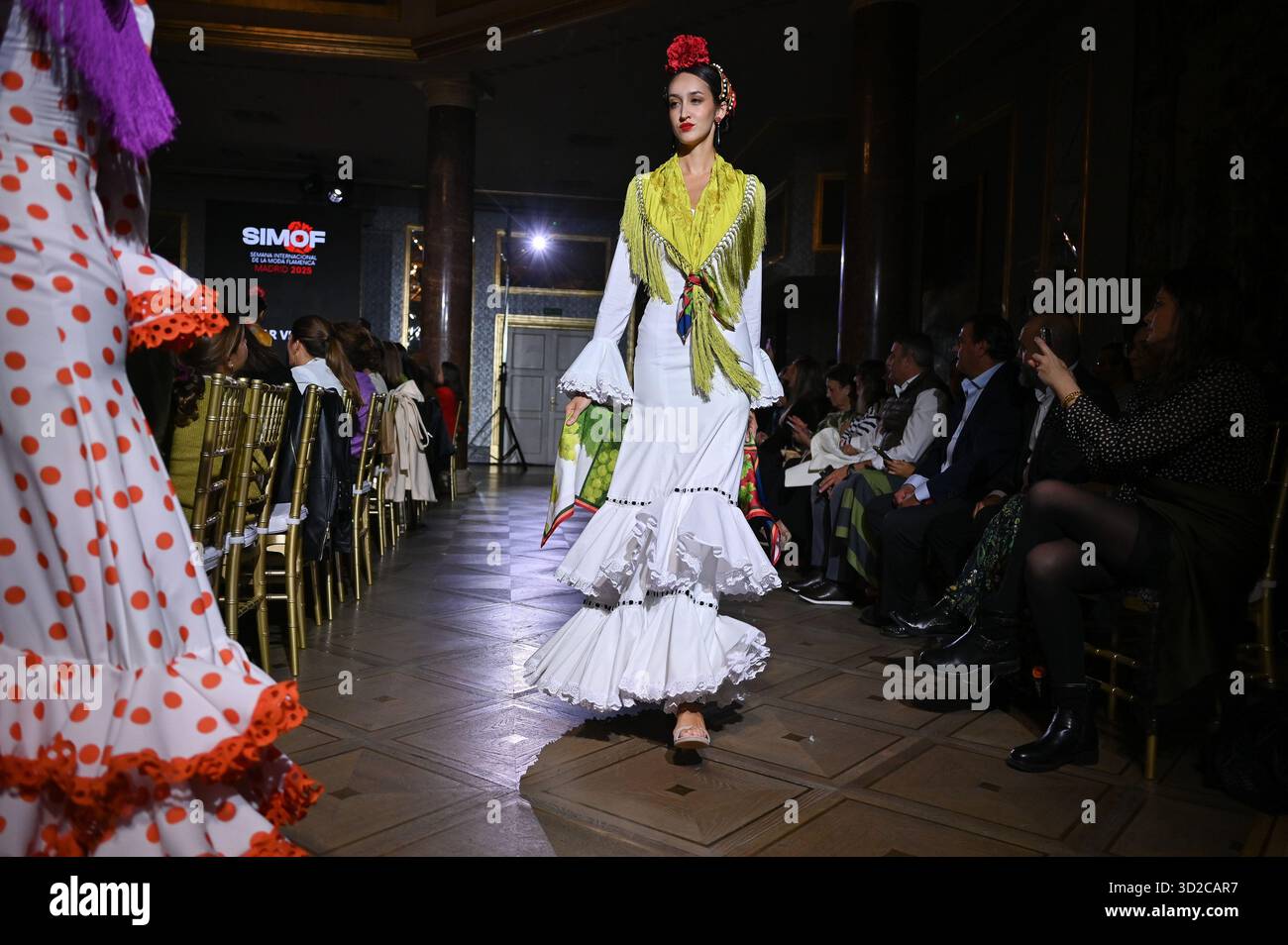 A model walks in a Angela Isa design at the International Flamenco ...