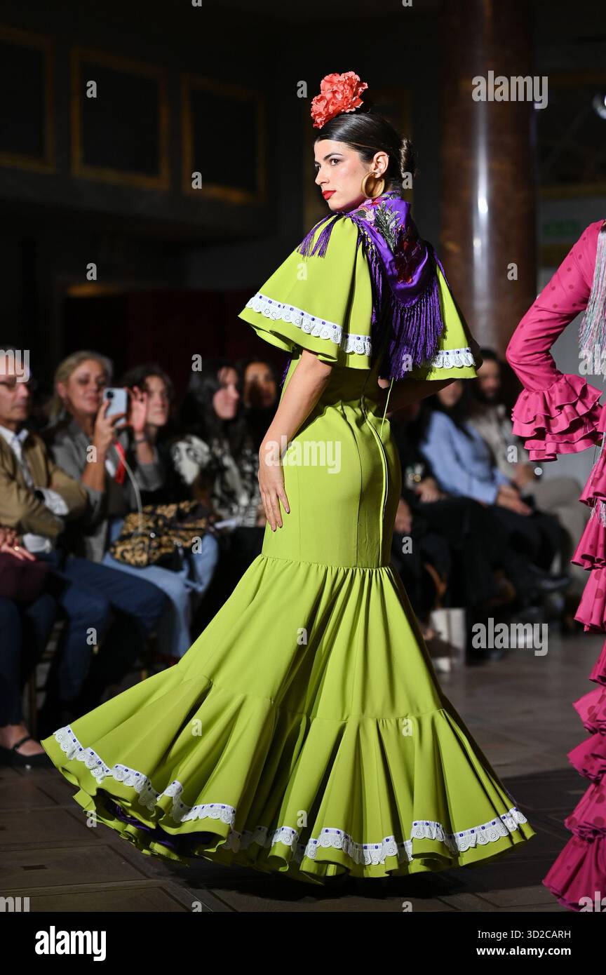 A model walks in a Angela Isa design at the International Flamenco ...