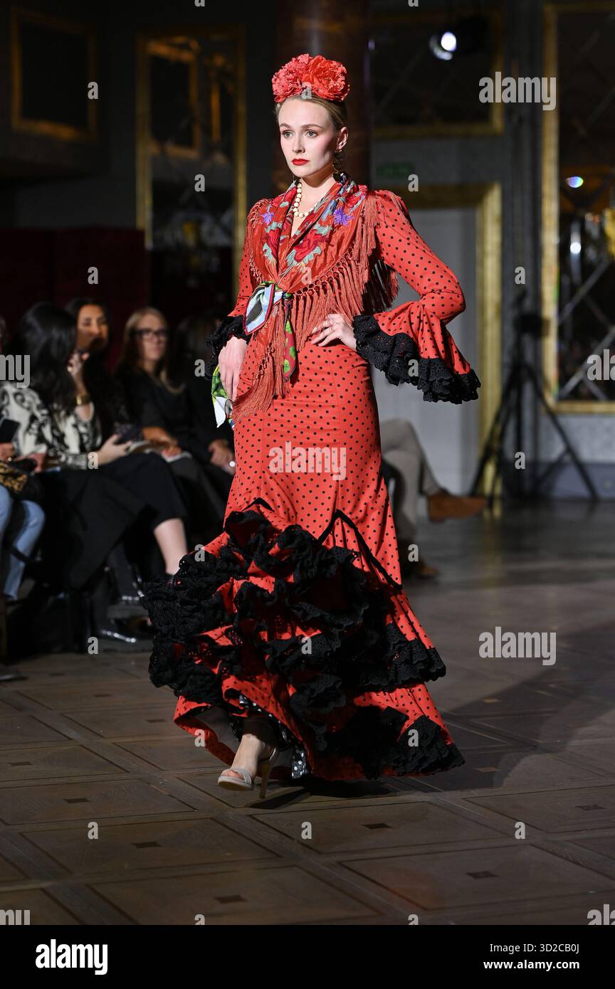 A model walks in a Angela Isa design at the International Flamenco ...