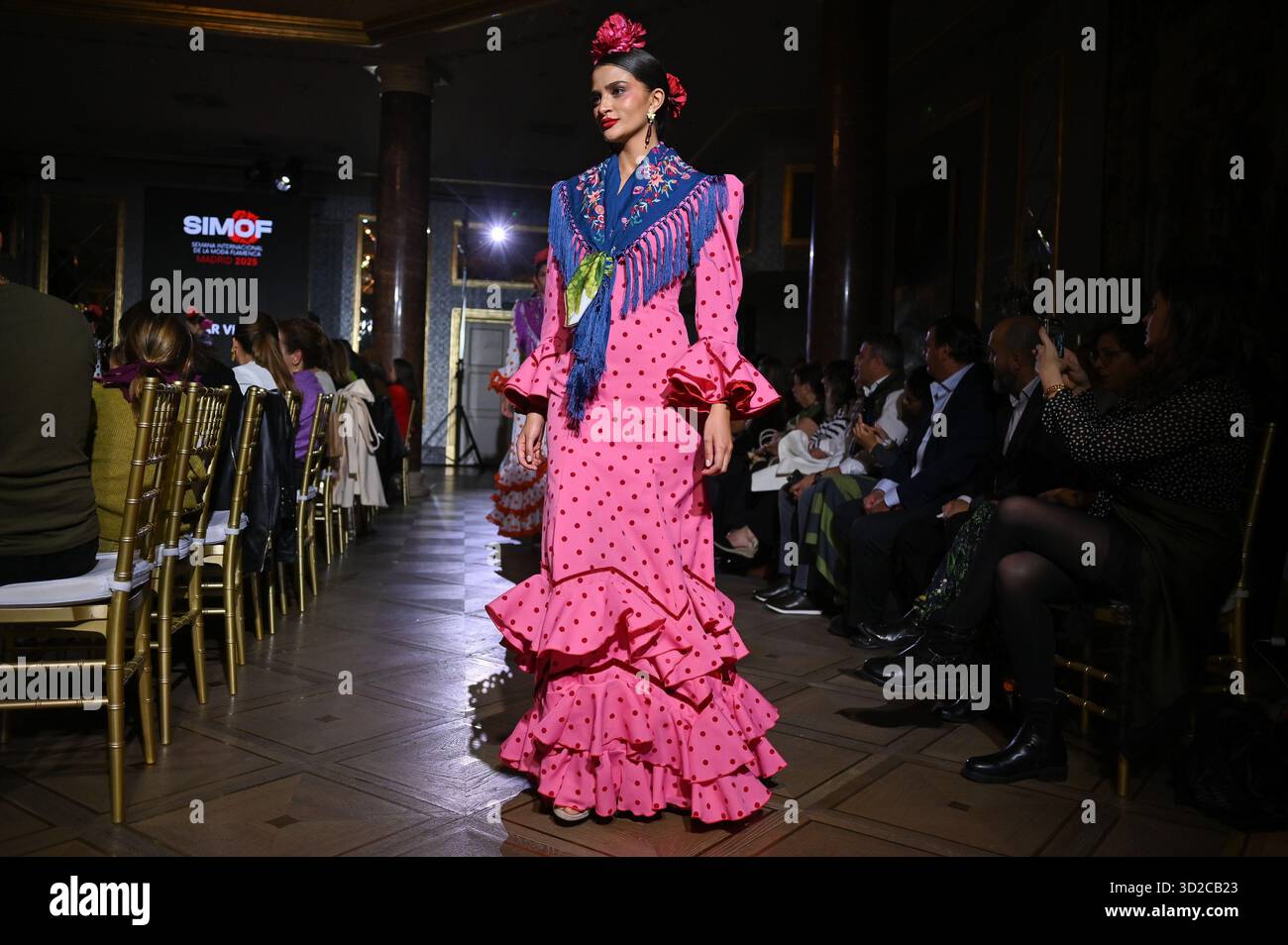 A model walks in a Angela Isa design at the International Flamenco ...