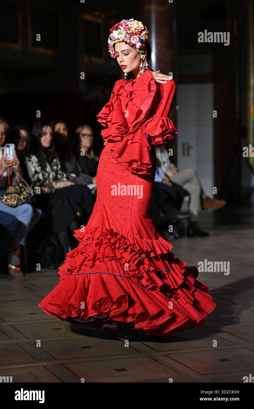 A model walks in a Angela Isa design at the International Flamenco ...