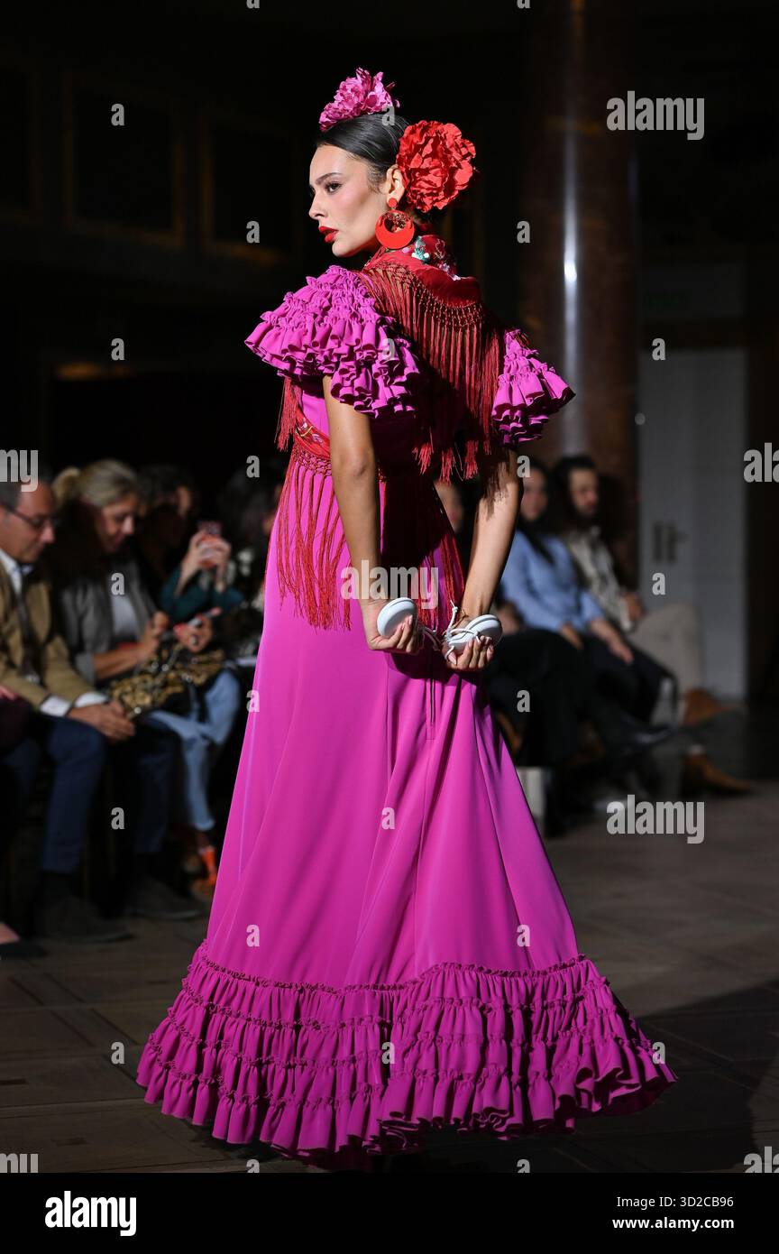 A model walks in a Angela Isa design at the International Flamenco ...