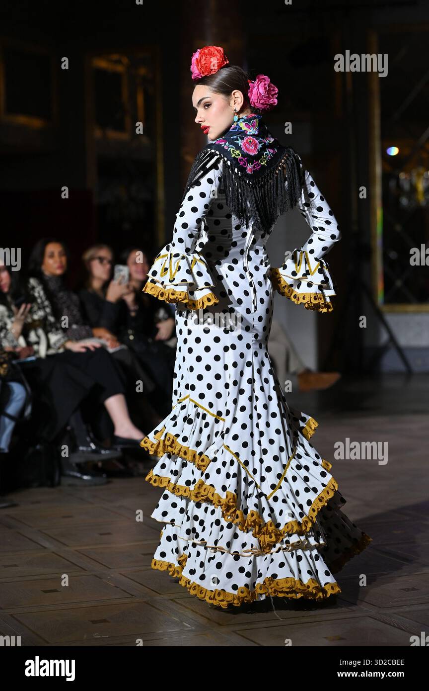 A model walks in a Angela Isa design at the International Flamenco ...