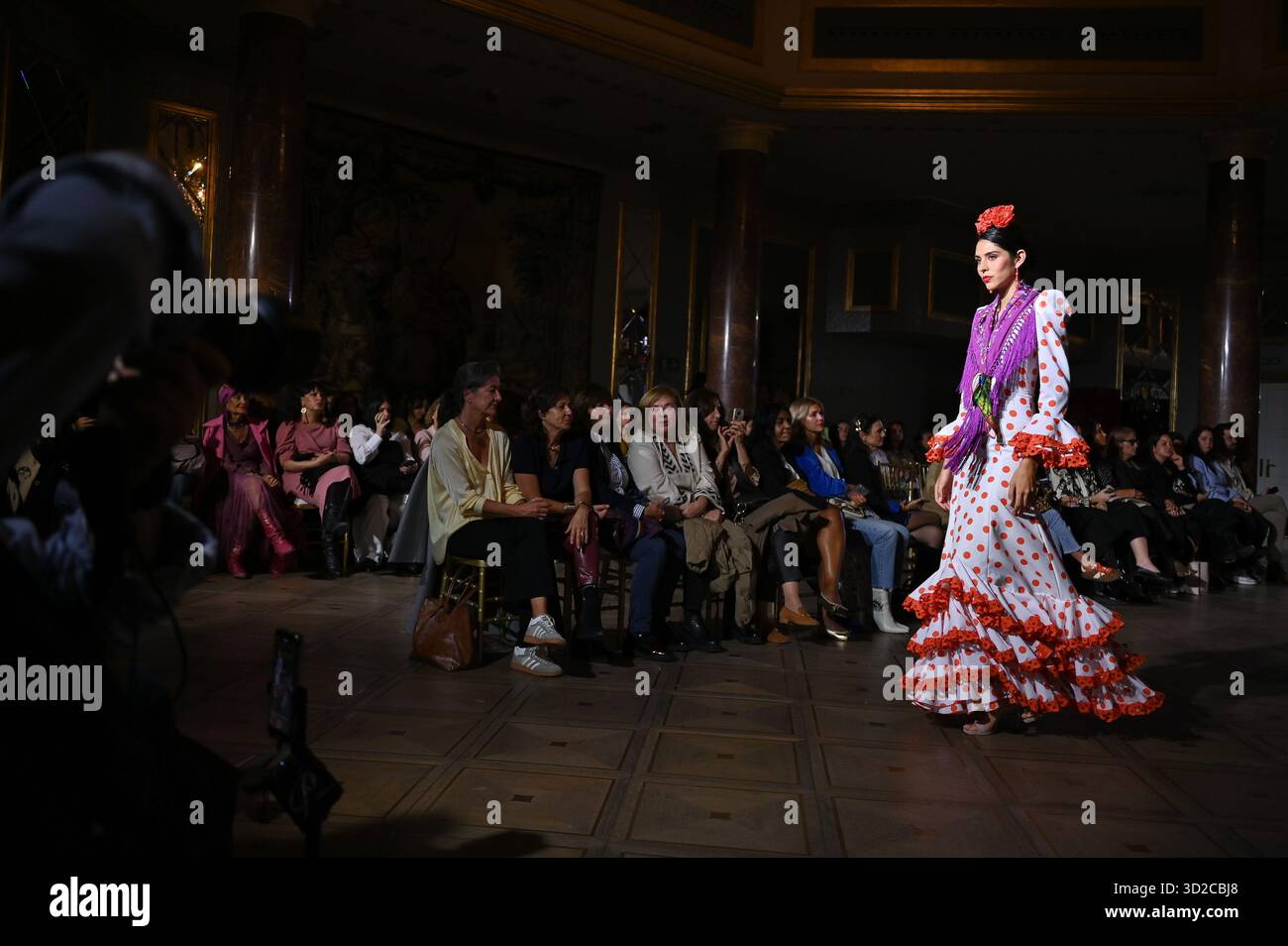A model walks in a Angela Isa design at the International Flamenco ...