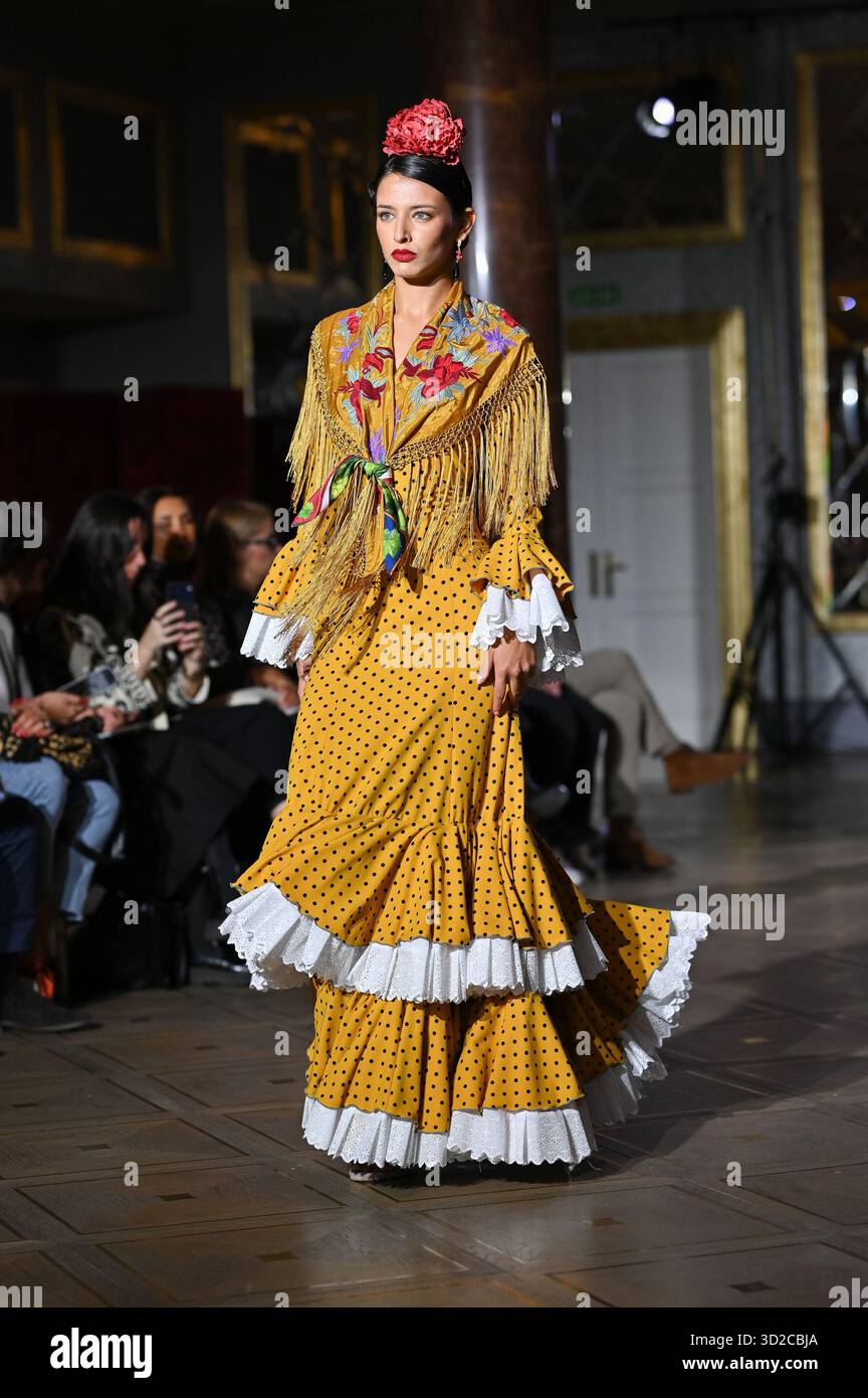 A model walks in a Angela Isa design at the International Flamenco ...