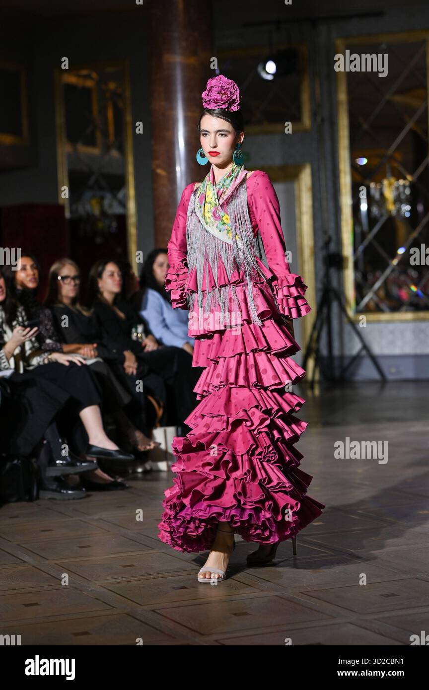 A model walks in a Angela Isa design at the International Flamenco ...