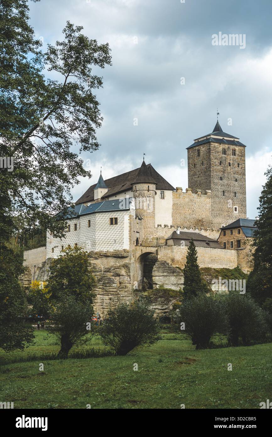 Medieval Kost Castle rising behind autumn forest, Czech Republic Stock ...