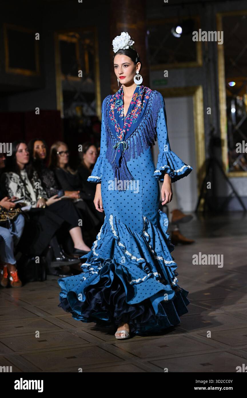 A model walks in a Angela Isa design at the International Flamenco ...