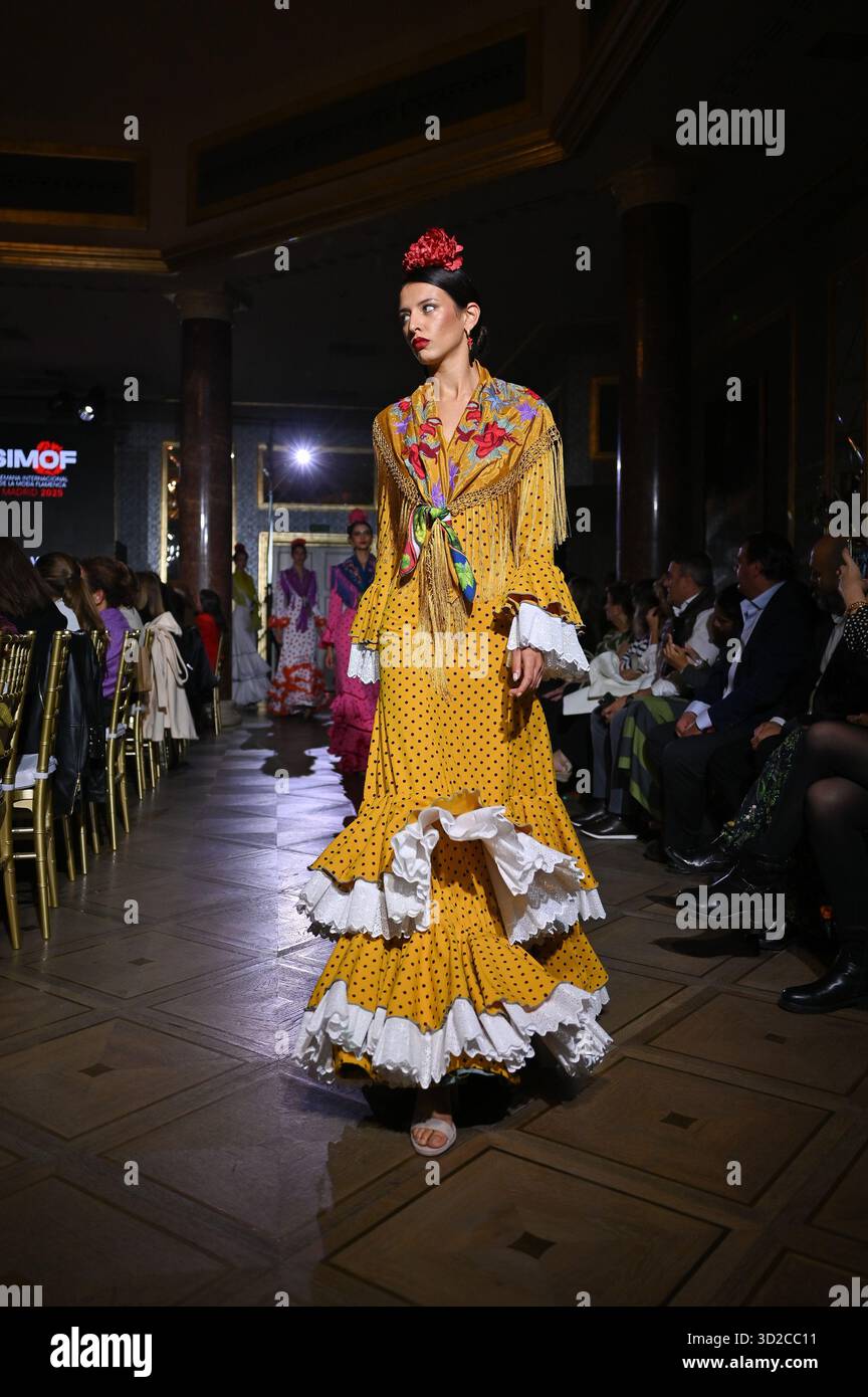 A model walks in a Angela Isa design at the International Flamenco ...