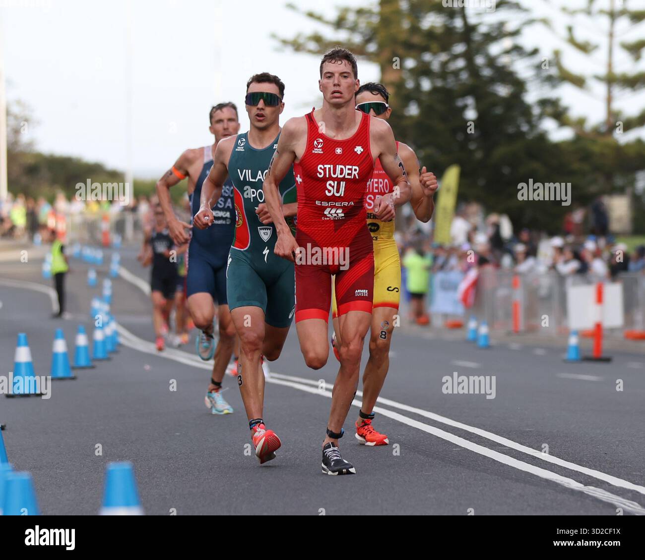 Max Studer, foreground, of Switzerland, at the 2025 World Triathlon Championship Wollongong, on ...