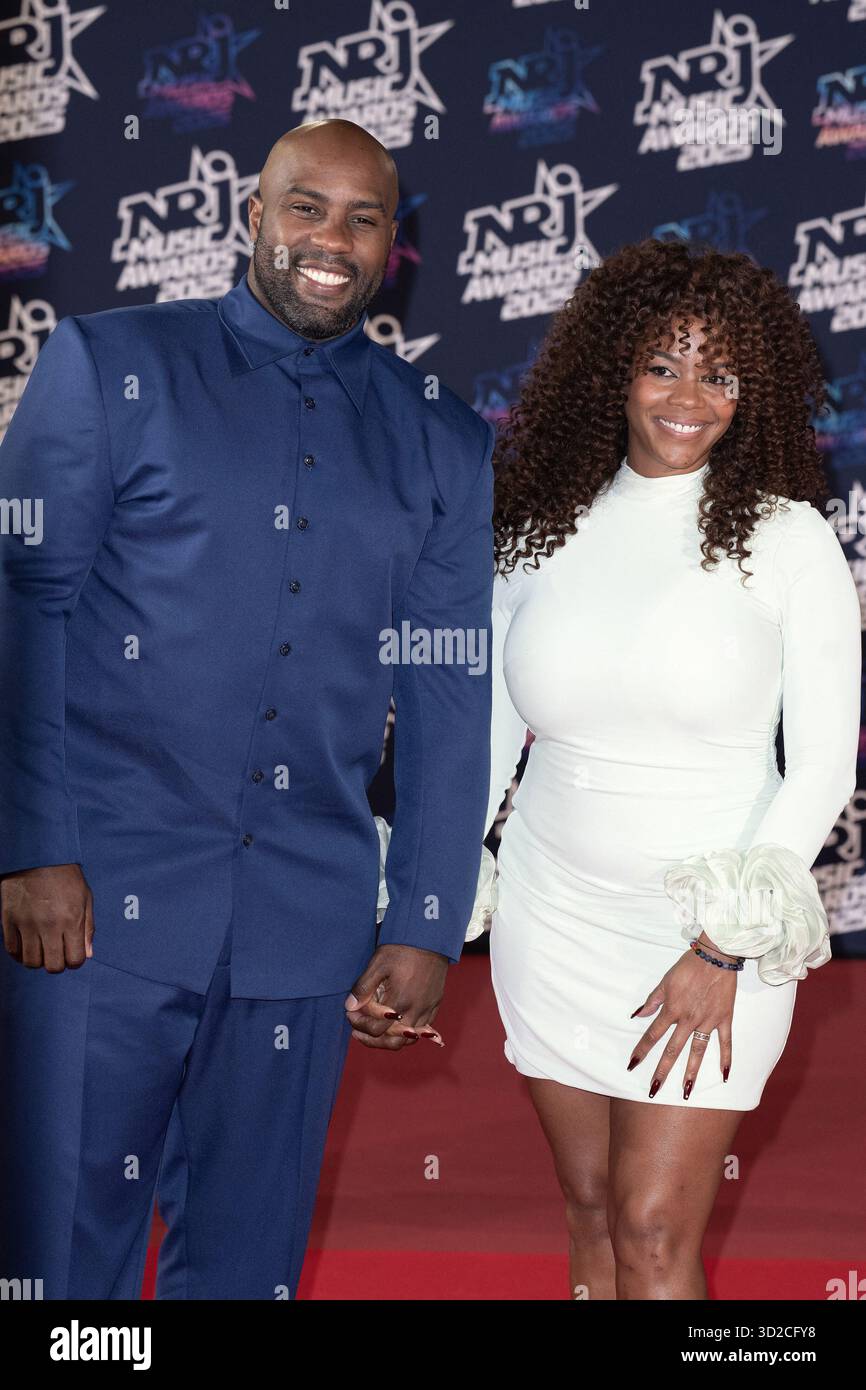 Teddy Riner and his wife Luthna Plocus attend the 27th NRJ Music Awards ...