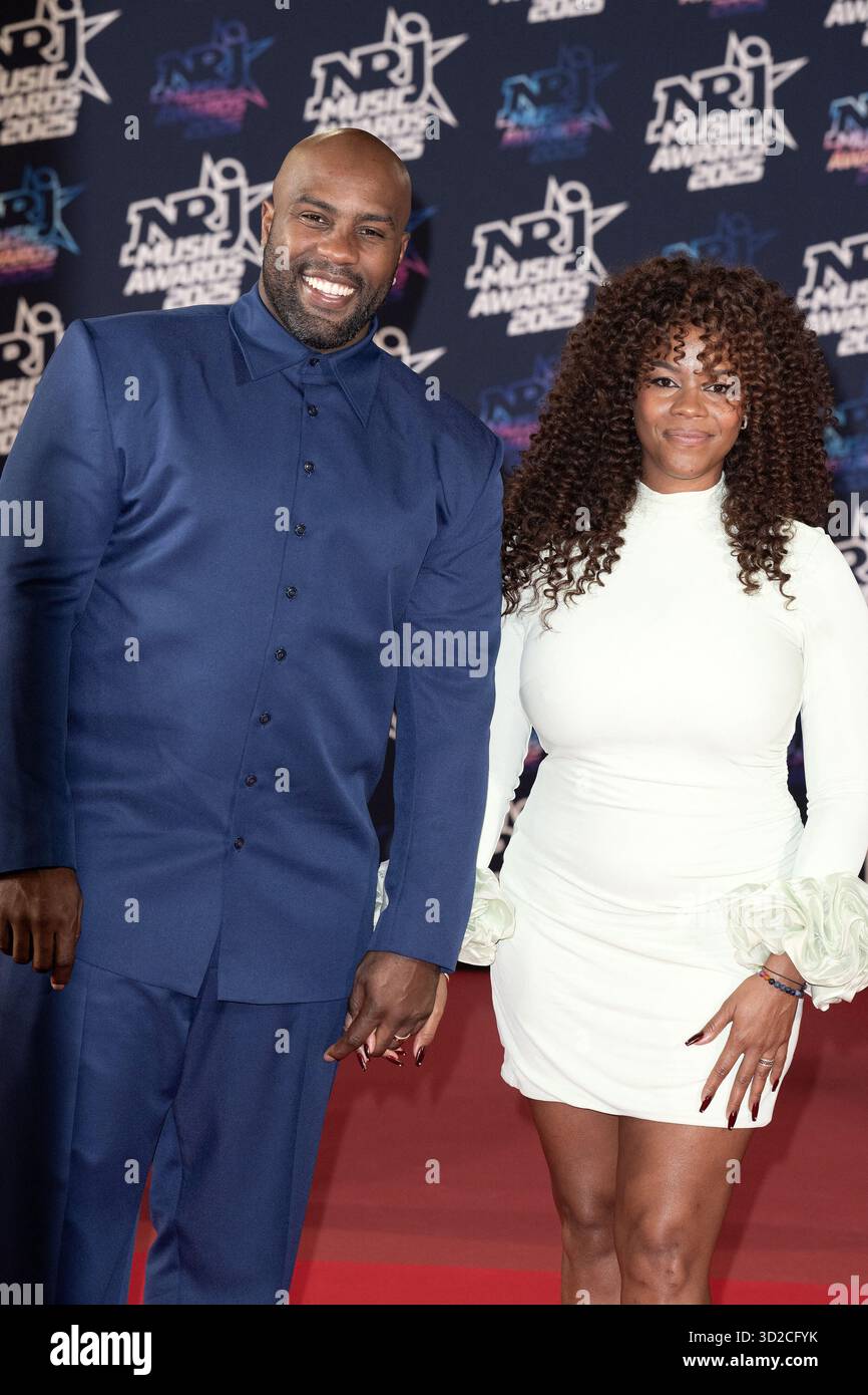 Teddy Riner and his wife Luthna Plocus attend the 27th NRJ Music Awards ...