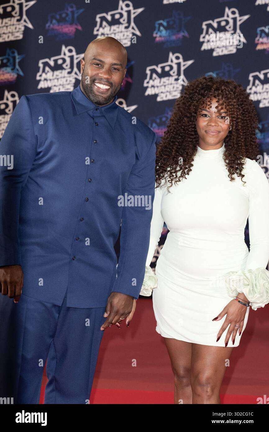 Teddy Riner and his wife Luthna Plocus attend the 27th NRJ Music Awards ...