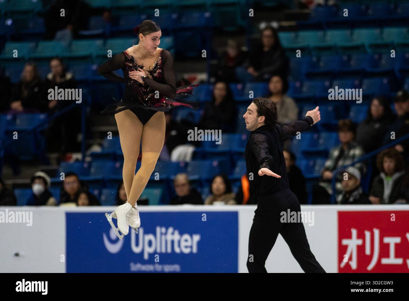 Kelly Ann Laurin and Loucas Ethier of Canada skate in the Pairs Short ...