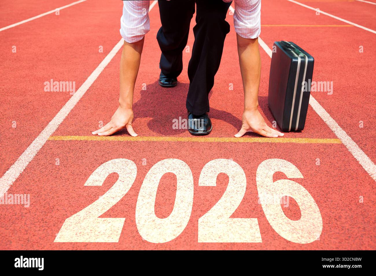 Happy new year 2026 concept. Business Man preparing to run on athletics ...