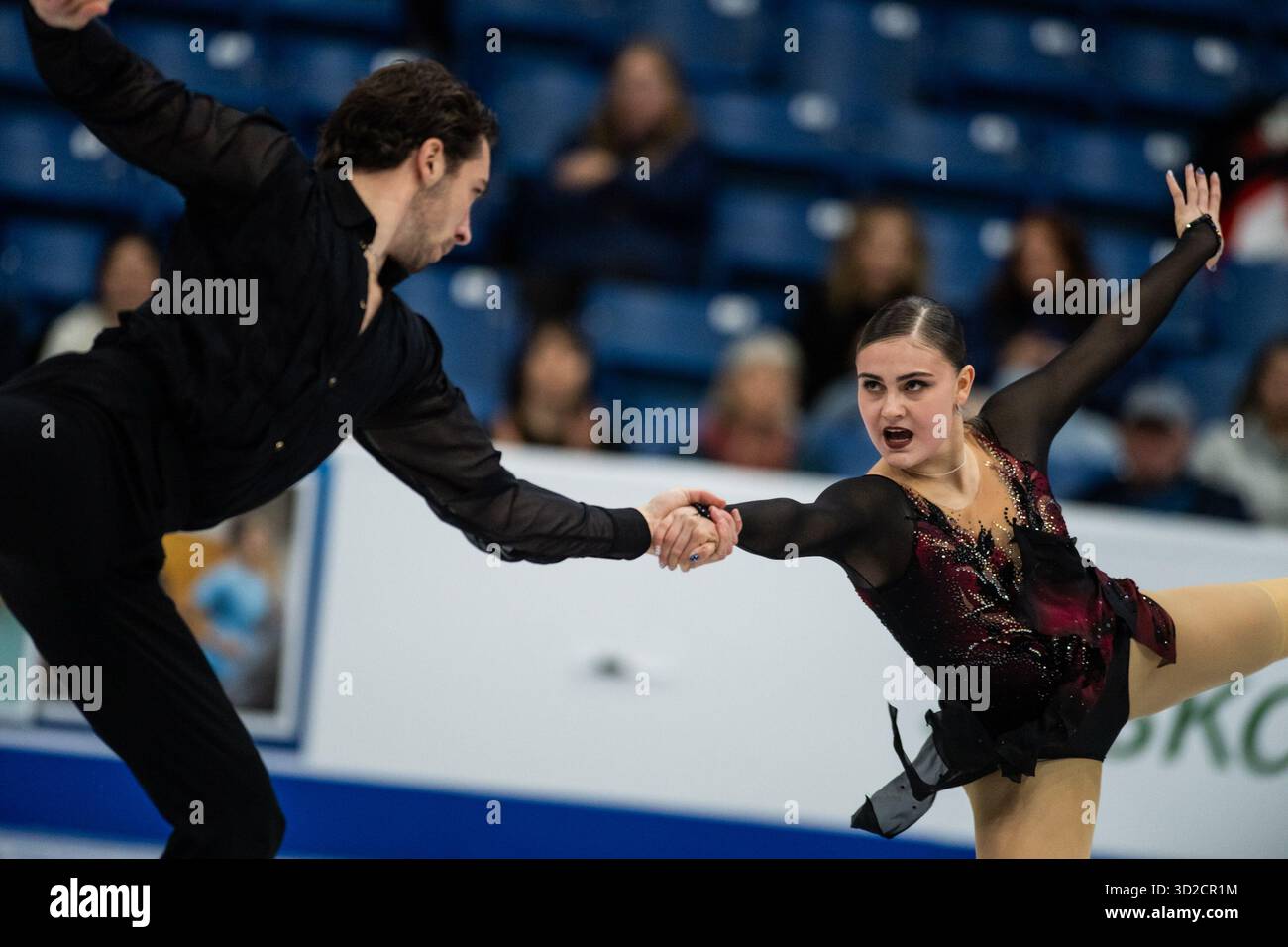 Kelly Ann Laurin and Loucas Ethier of Canada skate in the Pairs Short ...