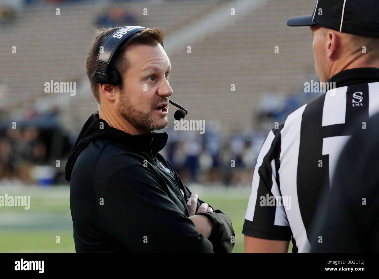 Memphis head coach Ryan Silverfield, left, talks with an official after ...