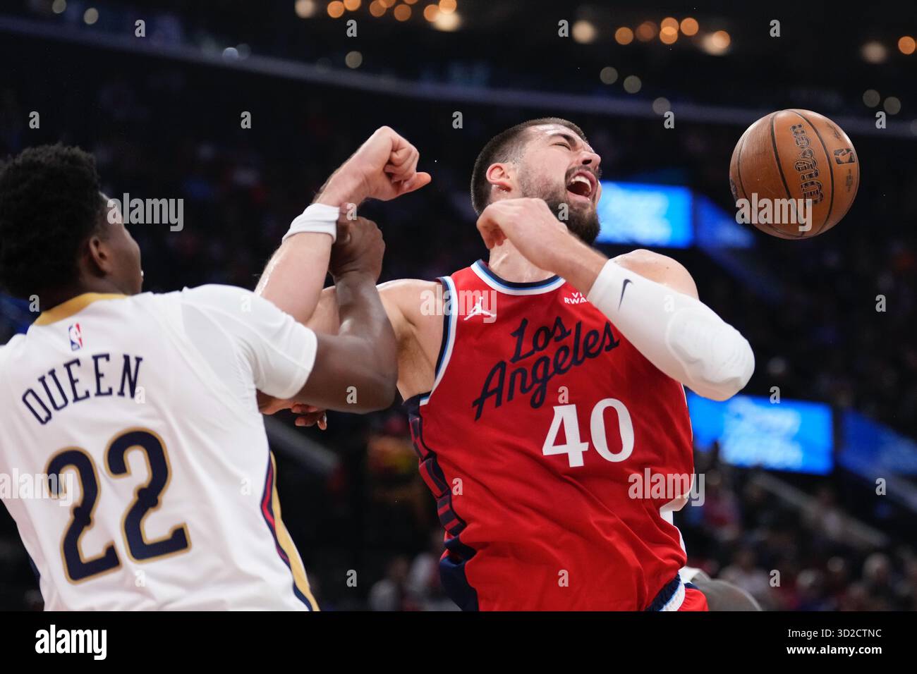 New Orleans Pelicans center Derik Queen, left, fouls Los Angeles ...