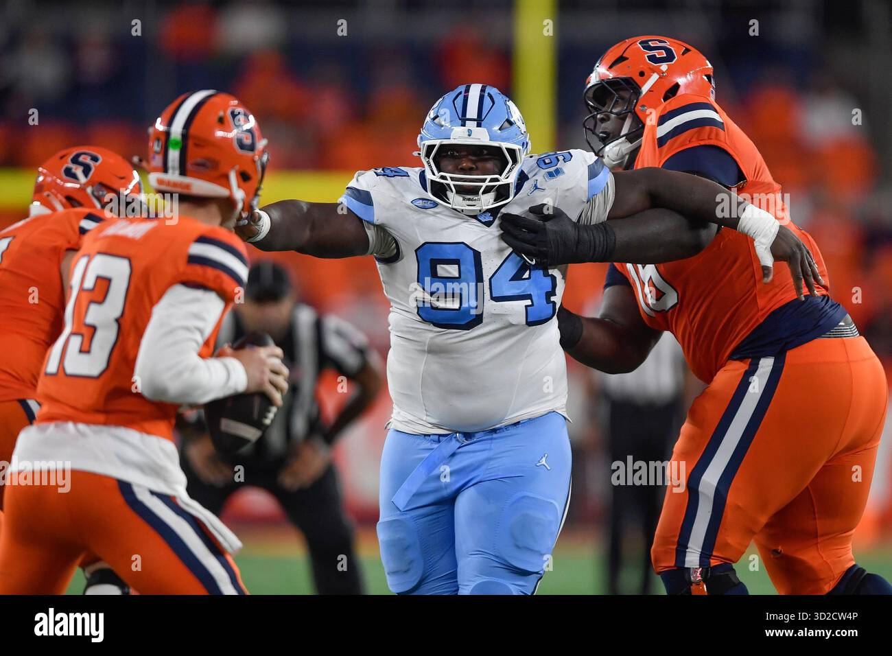 North Carolina defensive lineman Isaiah Johnson, center, rushes ...