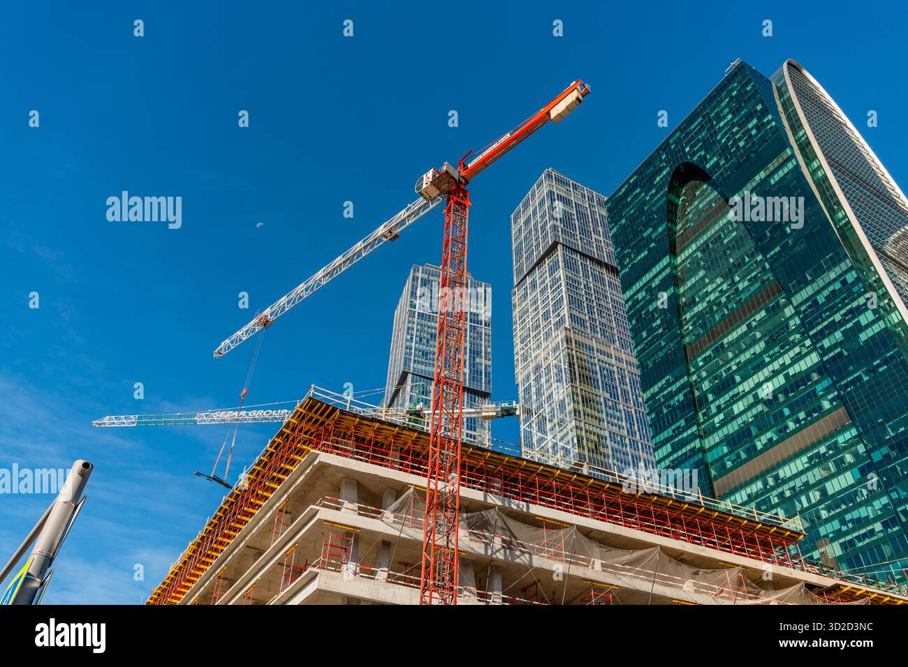 Construction cranes among the skyscrapers in Moscow City. Moscow ...