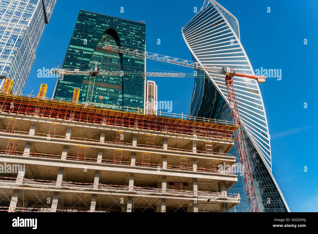 Construction cranes among the skyscrapers in Moscow City. Moscow ...