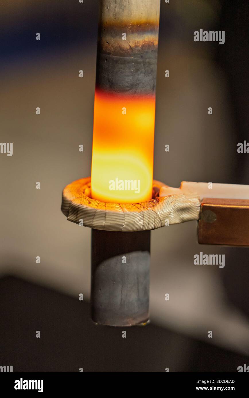 Induction hardening type of surface hardening . Metal part is induction ...